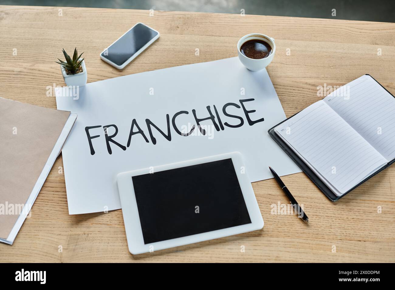 A modern office setting with a table displaying a sign that says ...