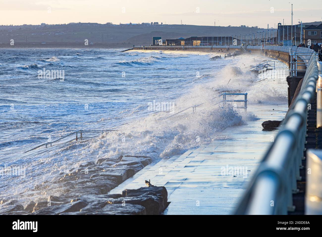 Waves crashing against the sea defences at Aberavon Beach, Port Talbot ...