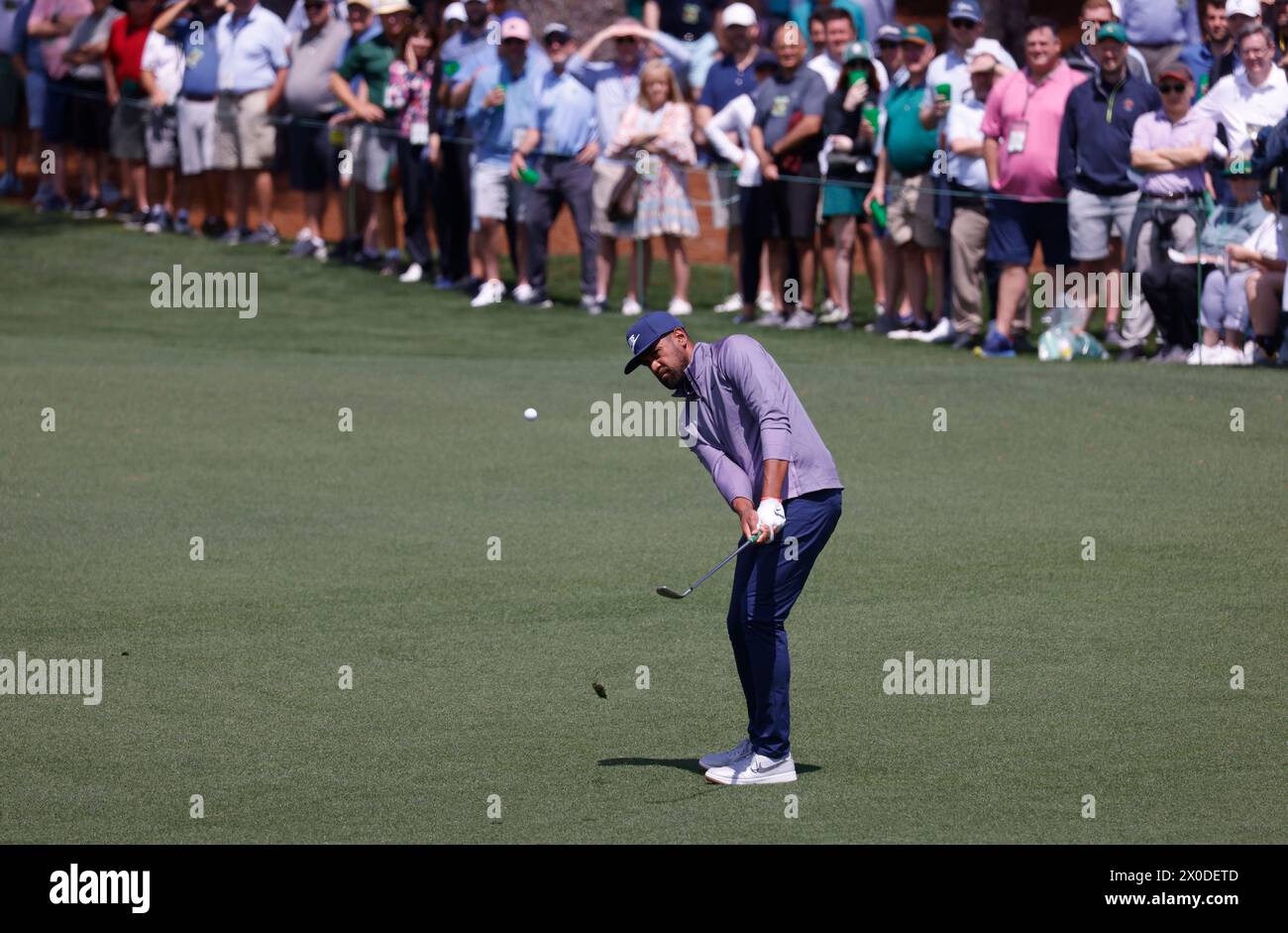 Augusta, United States. 11th Apr, 2024. Tony Finau chips to the green ...