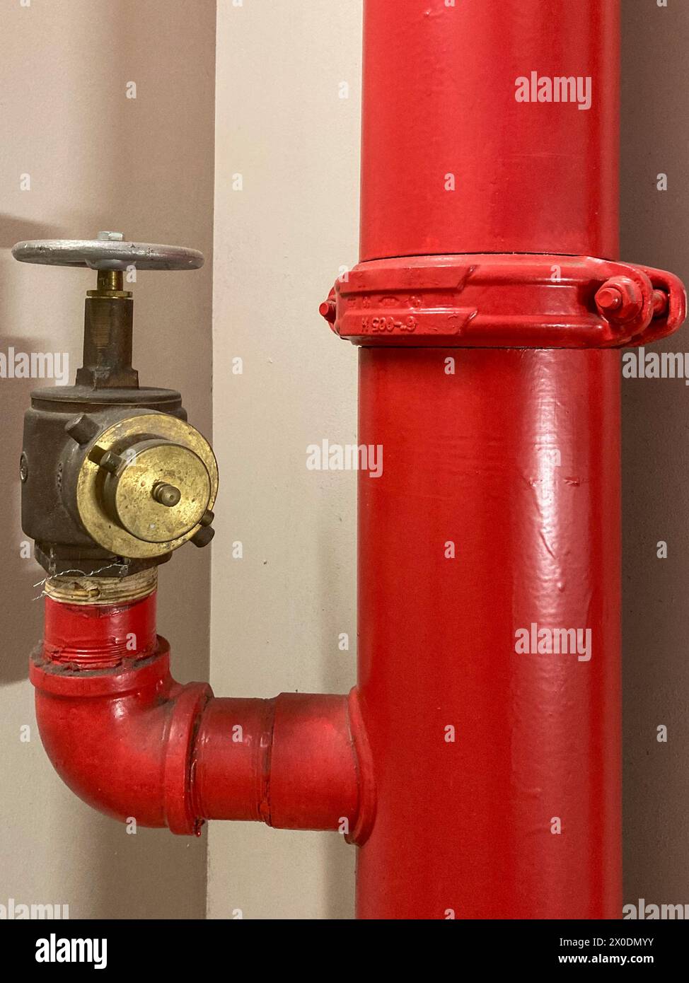 Red pipe with large valve Stock Photo - Alamy