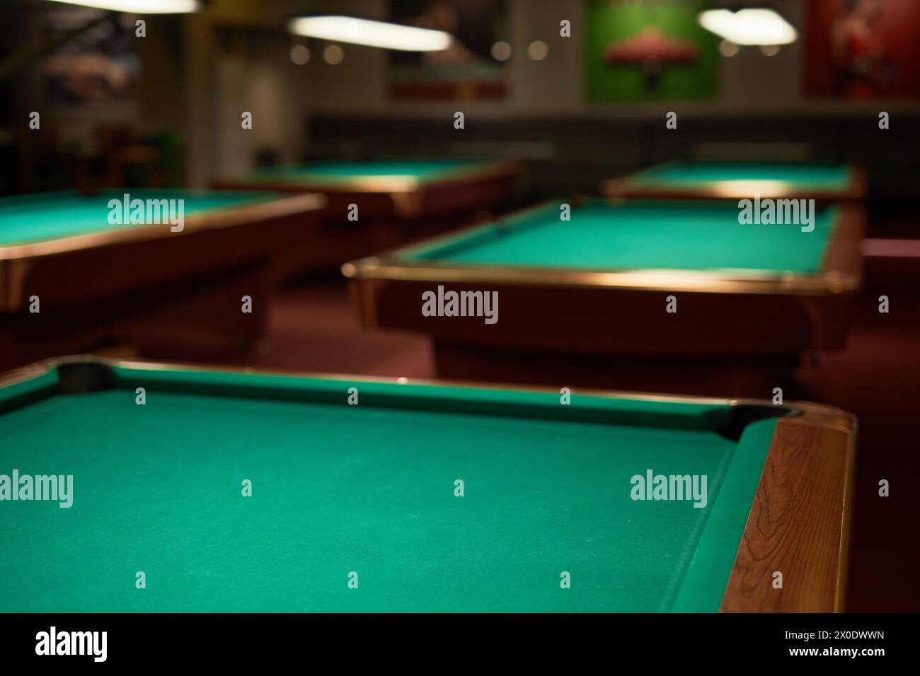 Detail background image of green billiard tables in gaming area at ...