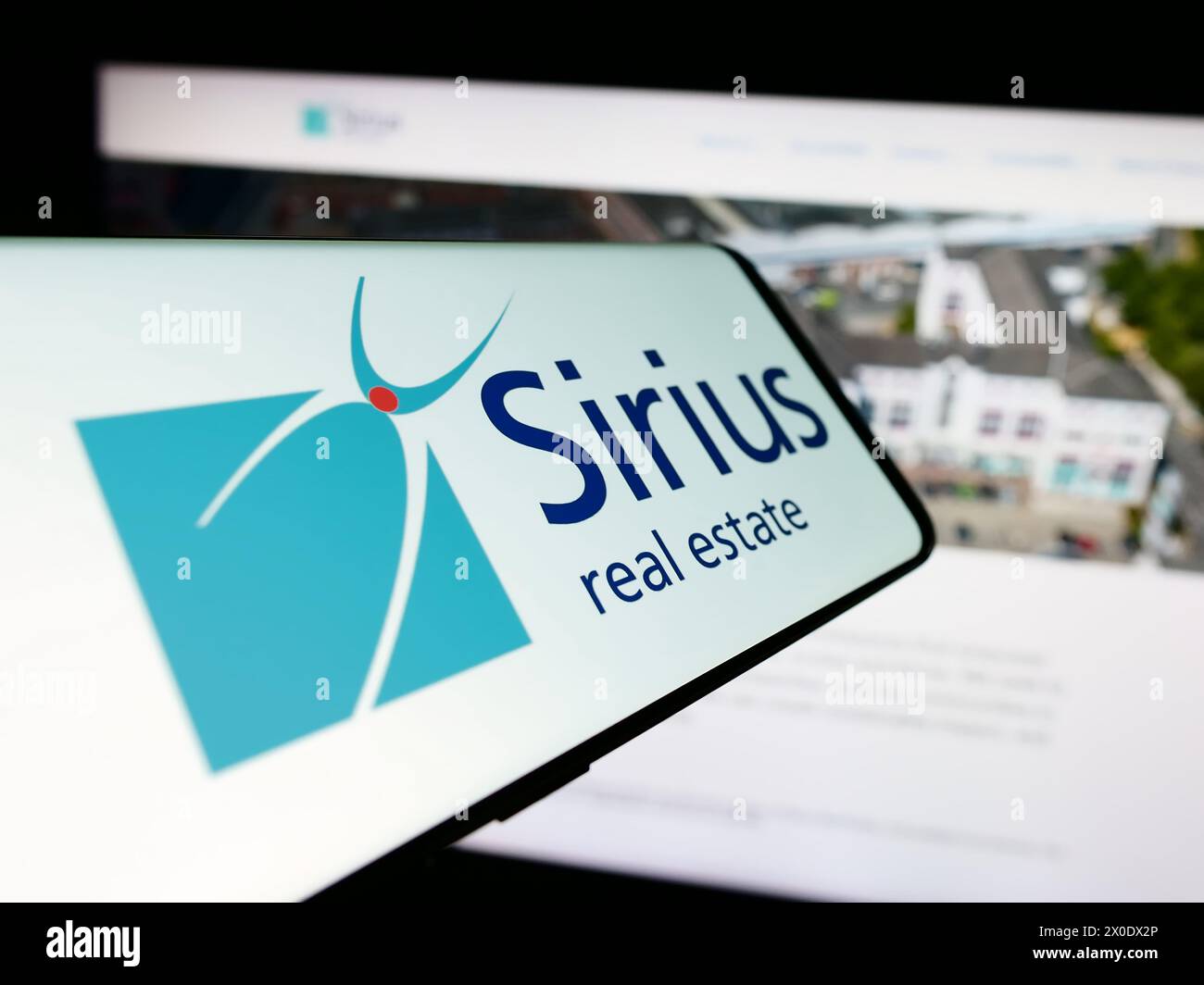 Mobile phone with logo of commercial property company Sirius Real ...