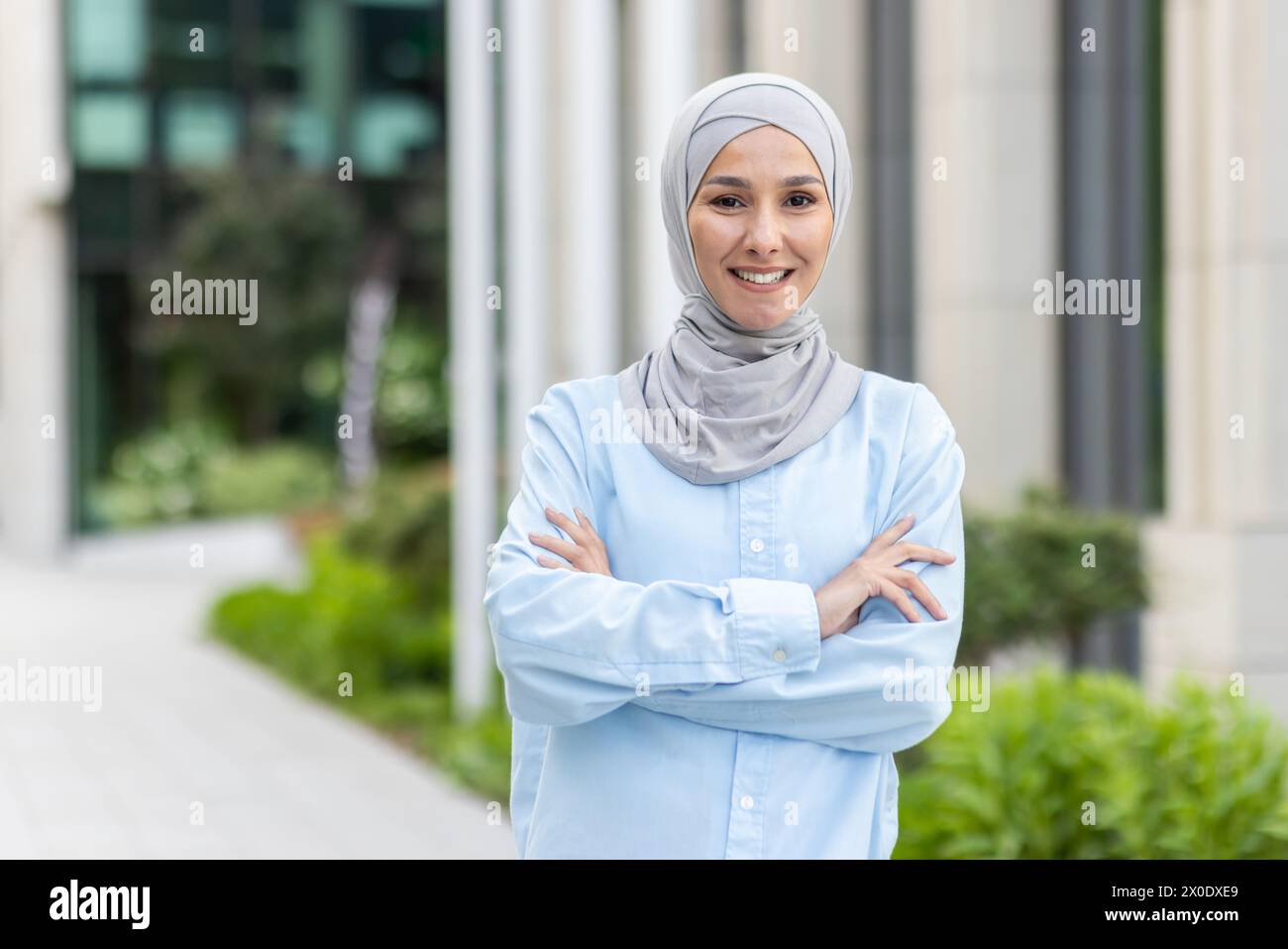Self confident smiling muslim female hi-res stock photography and ...