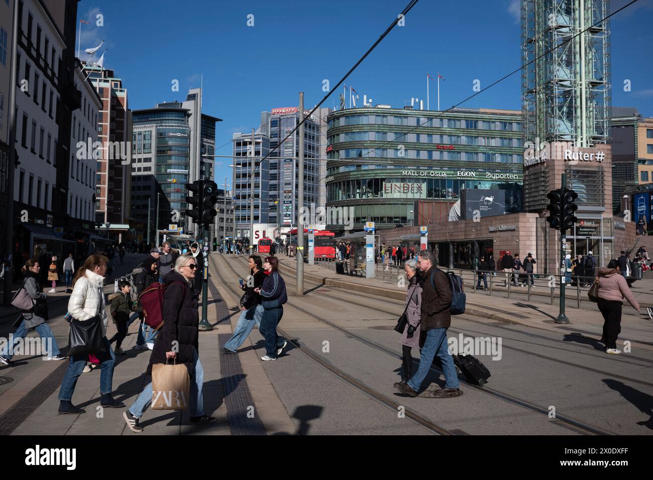 Commuters make their way along Fred Olsens Gate to Oslo Central Station ...