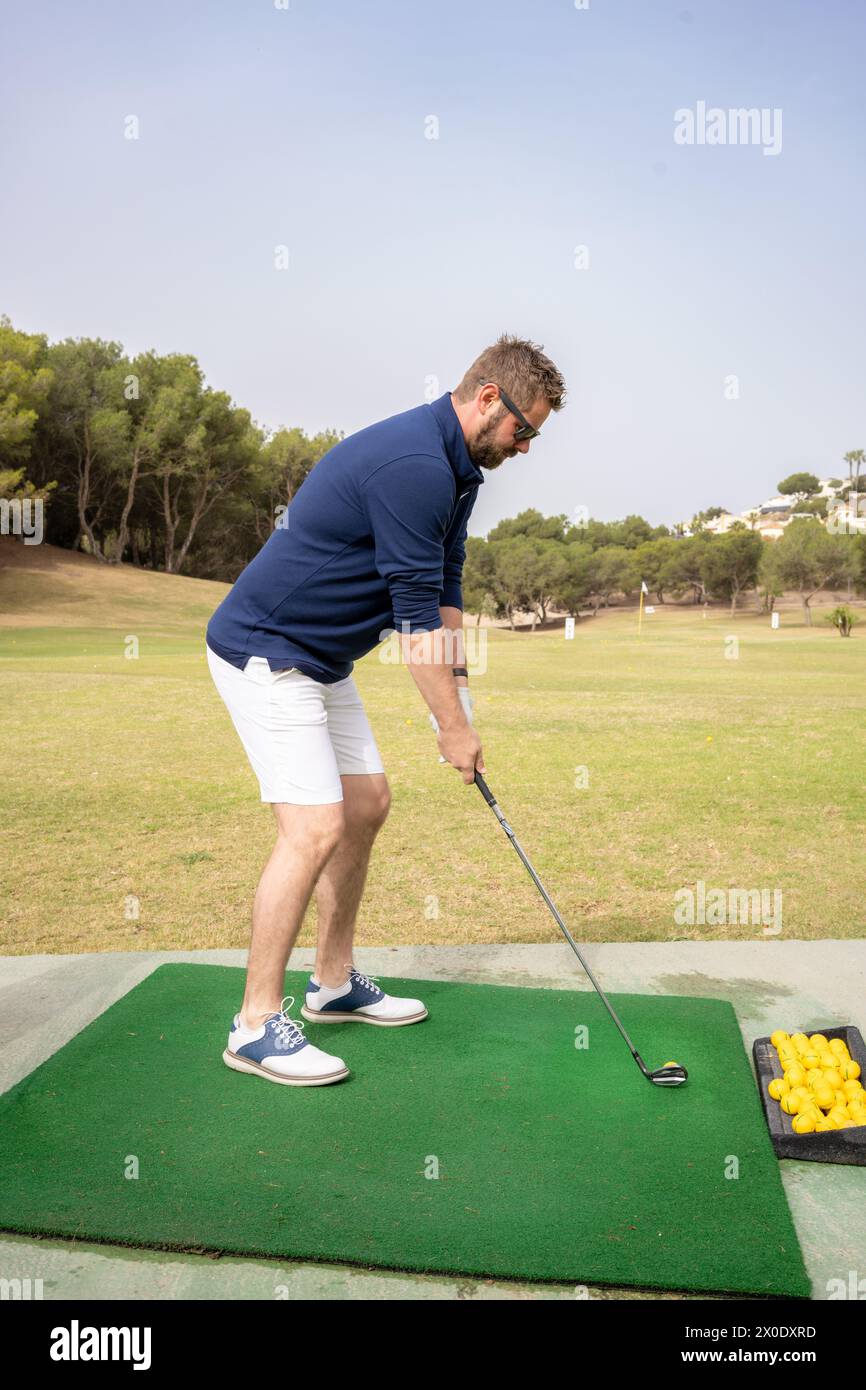 Person preparing swing driving range hi-res stock photography and ...