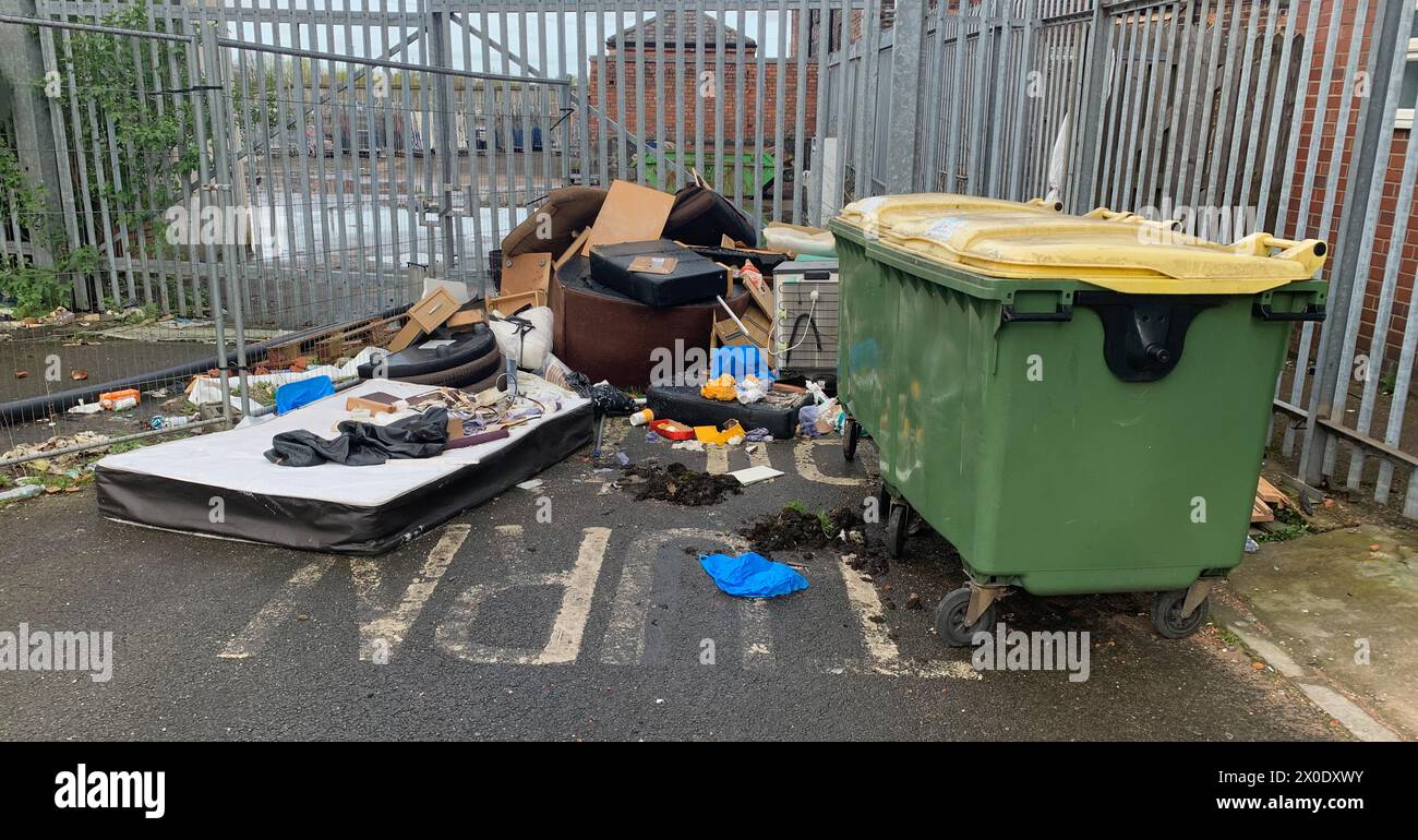 An image to show environmental impact of fly tipping in a town centre ...