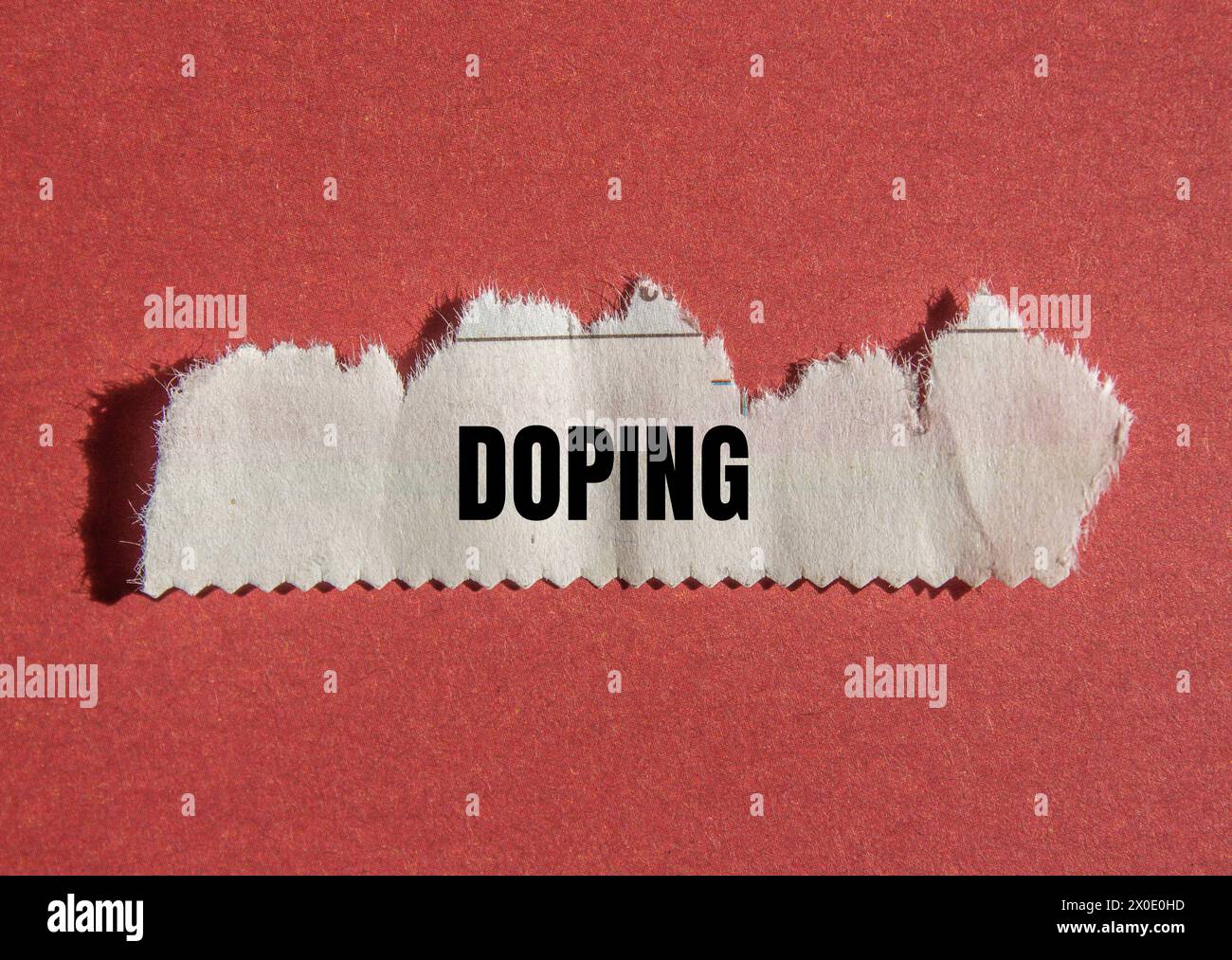 Doping word written on ripped newspaper piece with red background ... Doping word written on ripped newspaper piece with red background ...