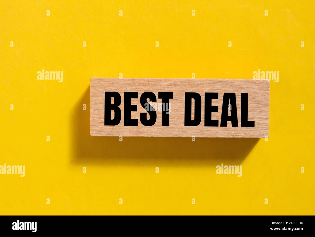 Best deal words written on wooden block with yellow background ...