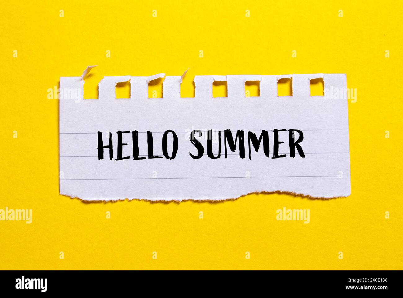 Hello summer words written on ripped paper with yellow background ...