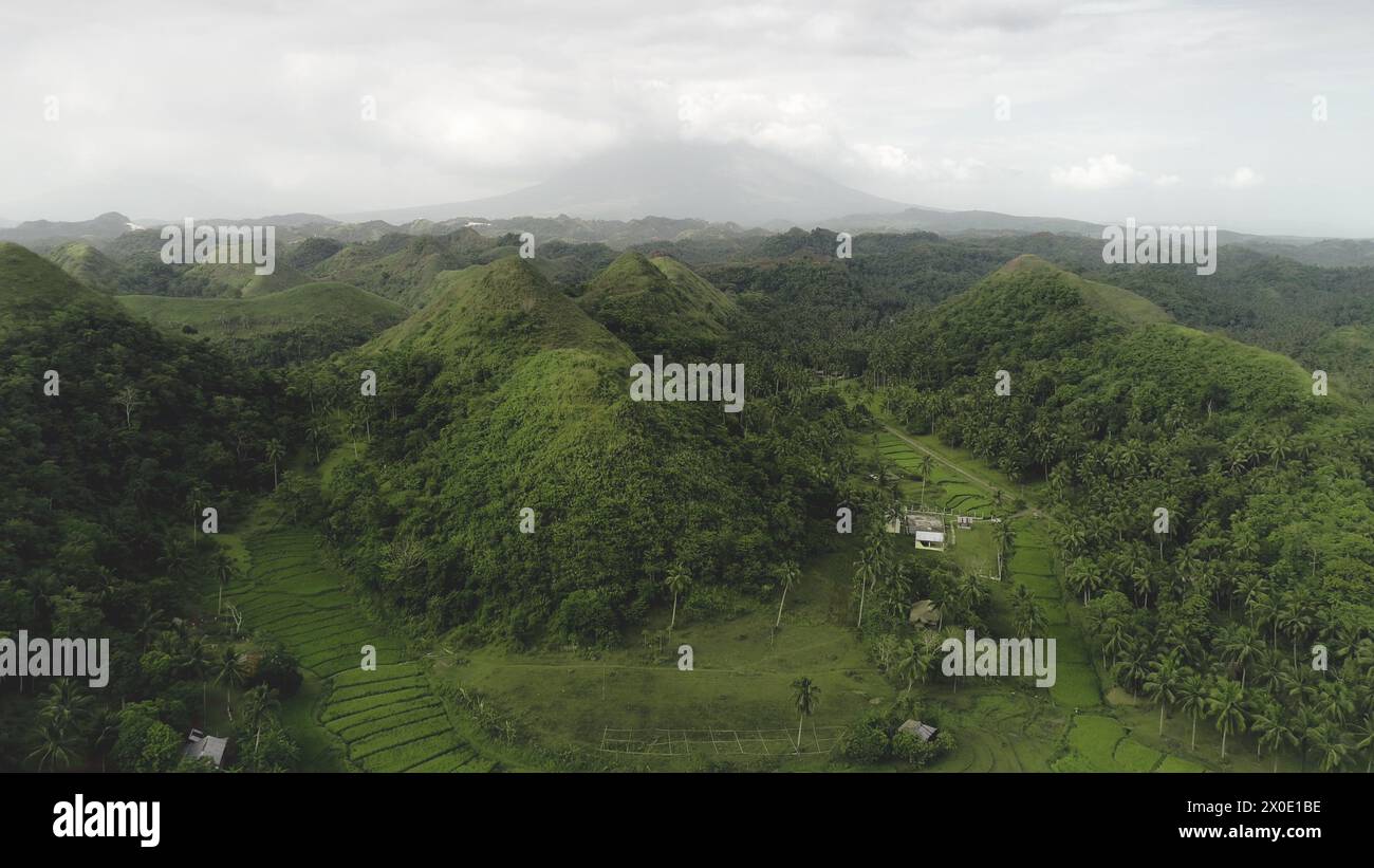 Asia countryside aerial: green hill view at volcano smoke haze on ...