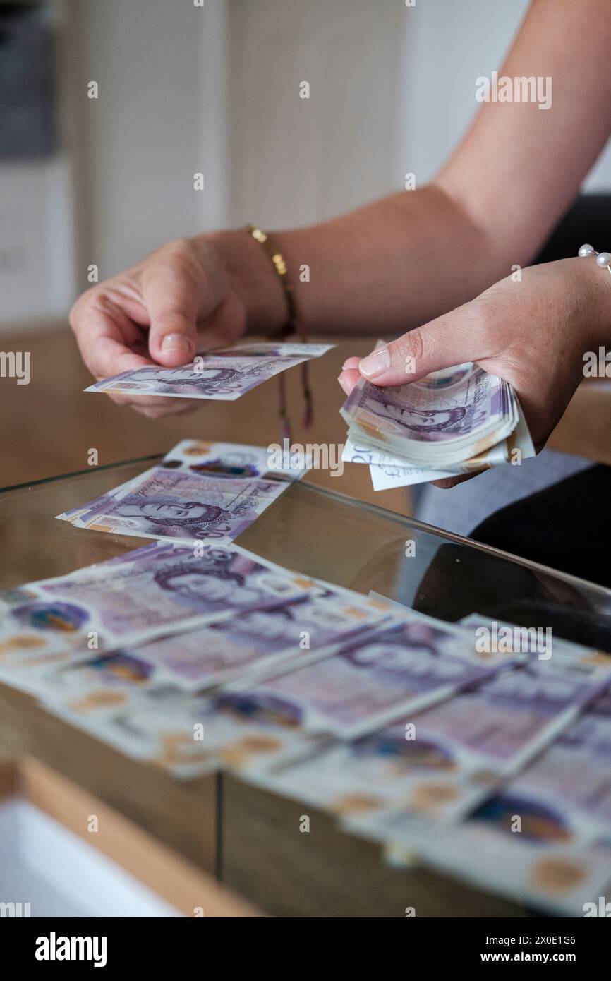 Counting money uk pound sterling hi-res stock photography and images ...