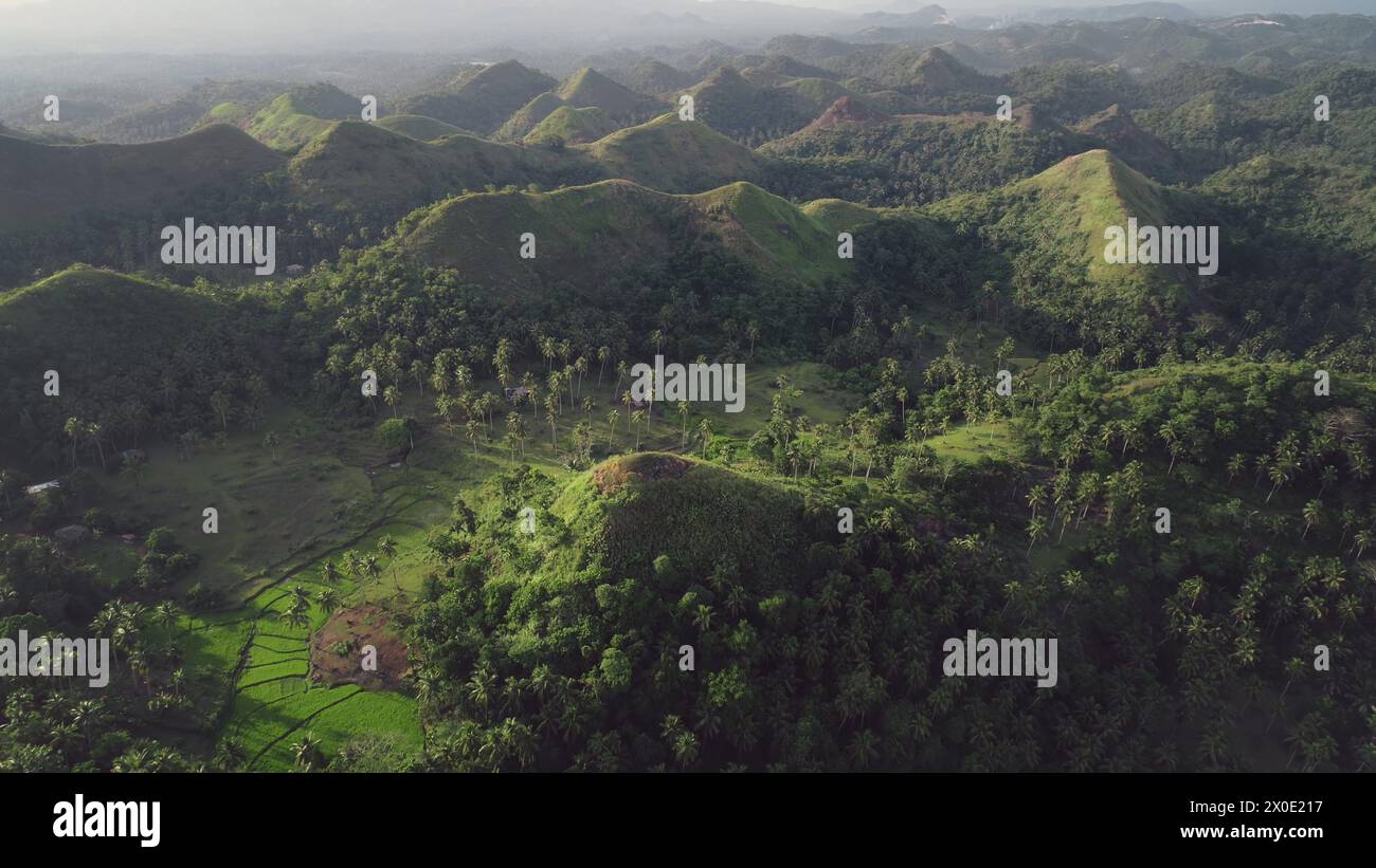 Rural Asia green mountain aerial: fields, valleys with abudant grass ...