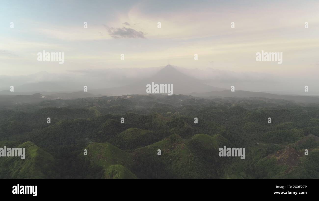 Jungle hills aerial at cloudy sky with Mayon Mount. Green plants at ...