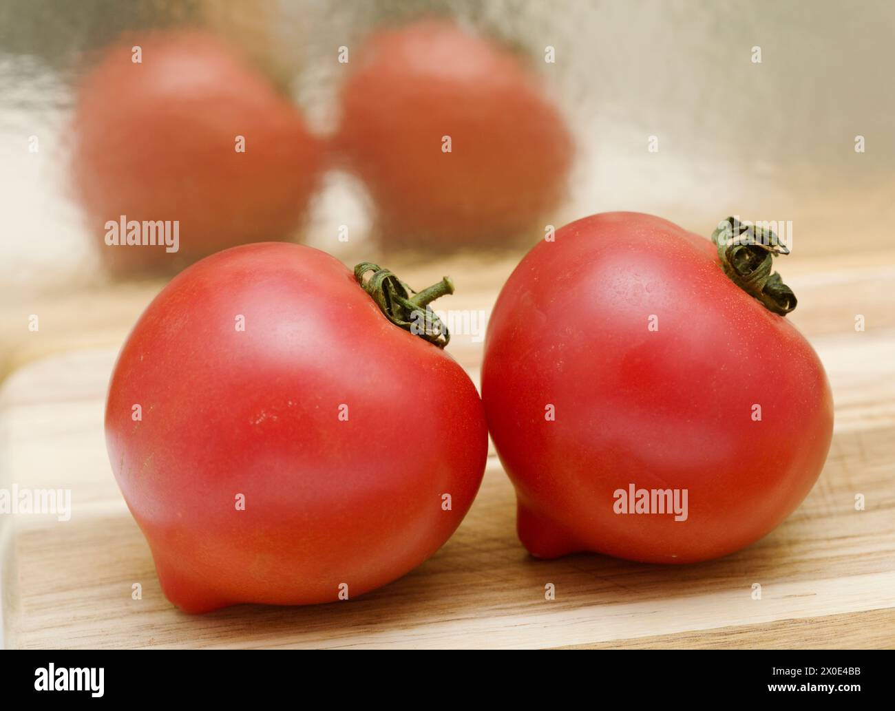 Round Pink tomato with a nose that produces heart shape when cut in ...