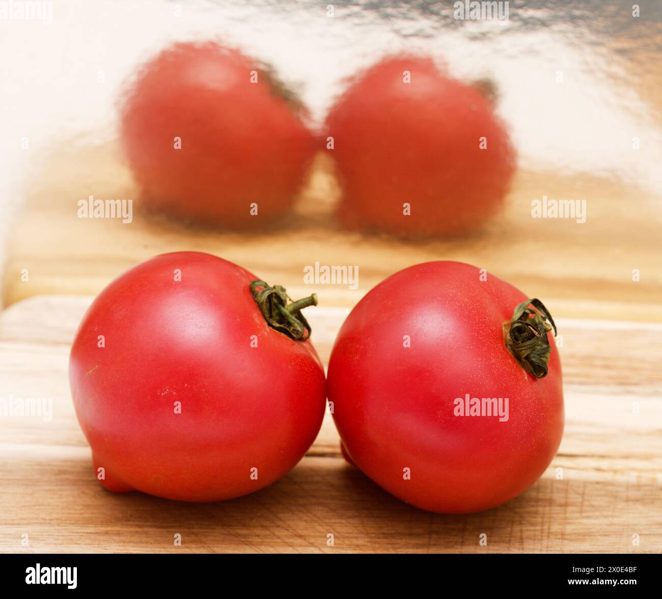Round Pink tomato with a nose that produces heart shape when cut in ...