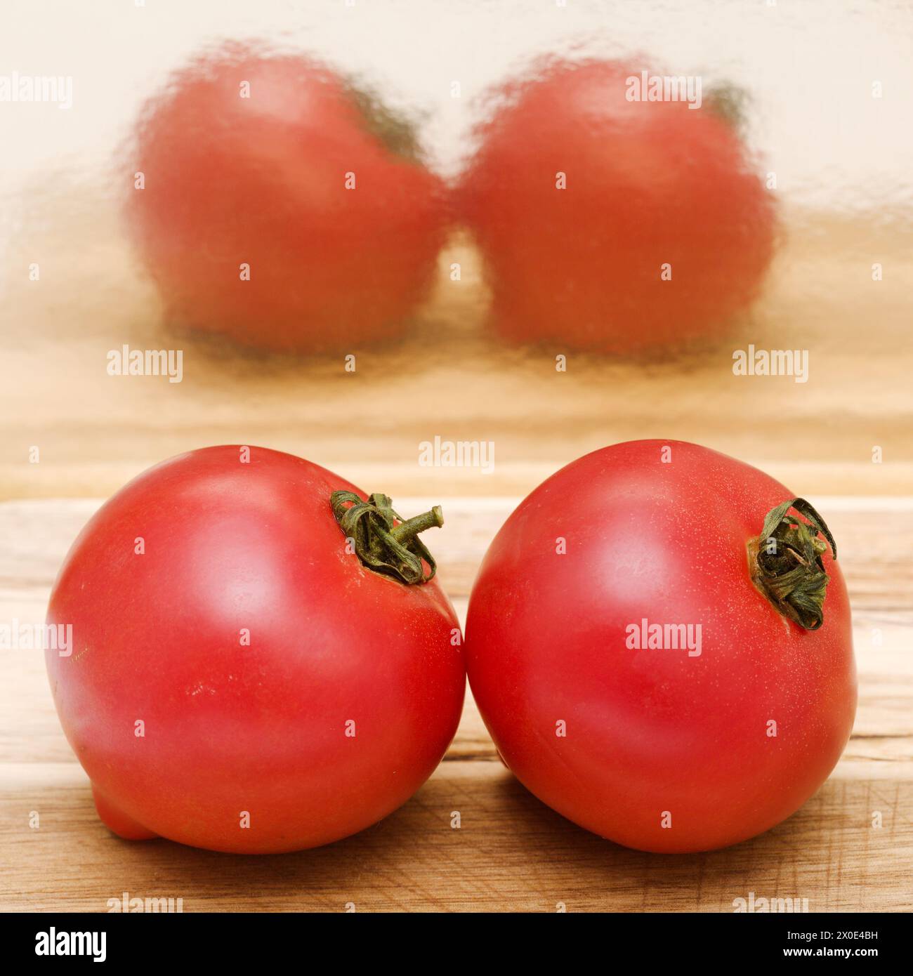 Round Pink tomato with a nose that produces heart shape when cut in ...