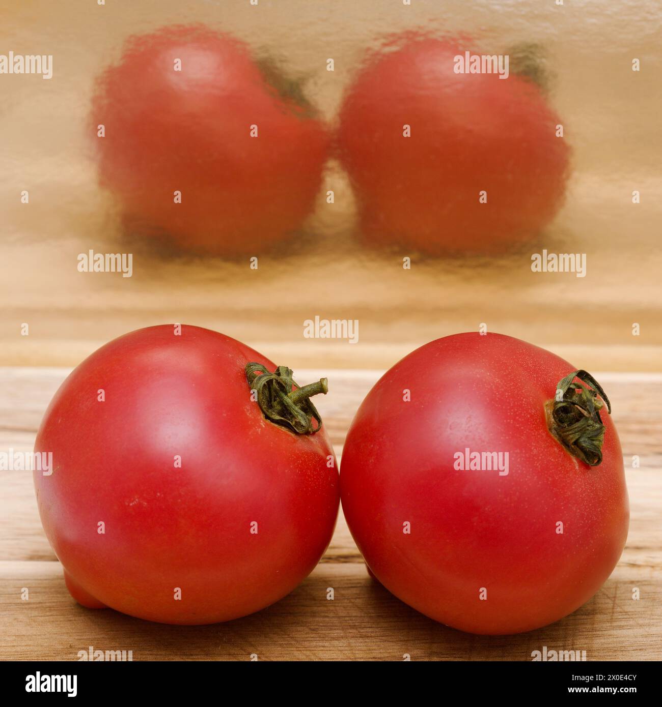 Round Pink tomato with a nose that produces heart shape when cut in ...