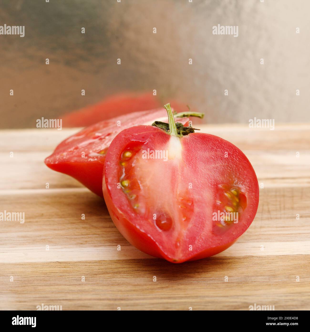 Round Pink tomato with a nose that produces heart shape when cut in ...