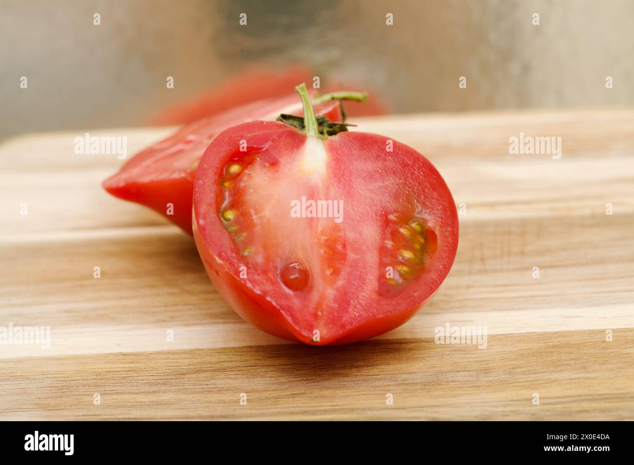 Round Pink tomato with a nose that produces heart shape when cut in ...