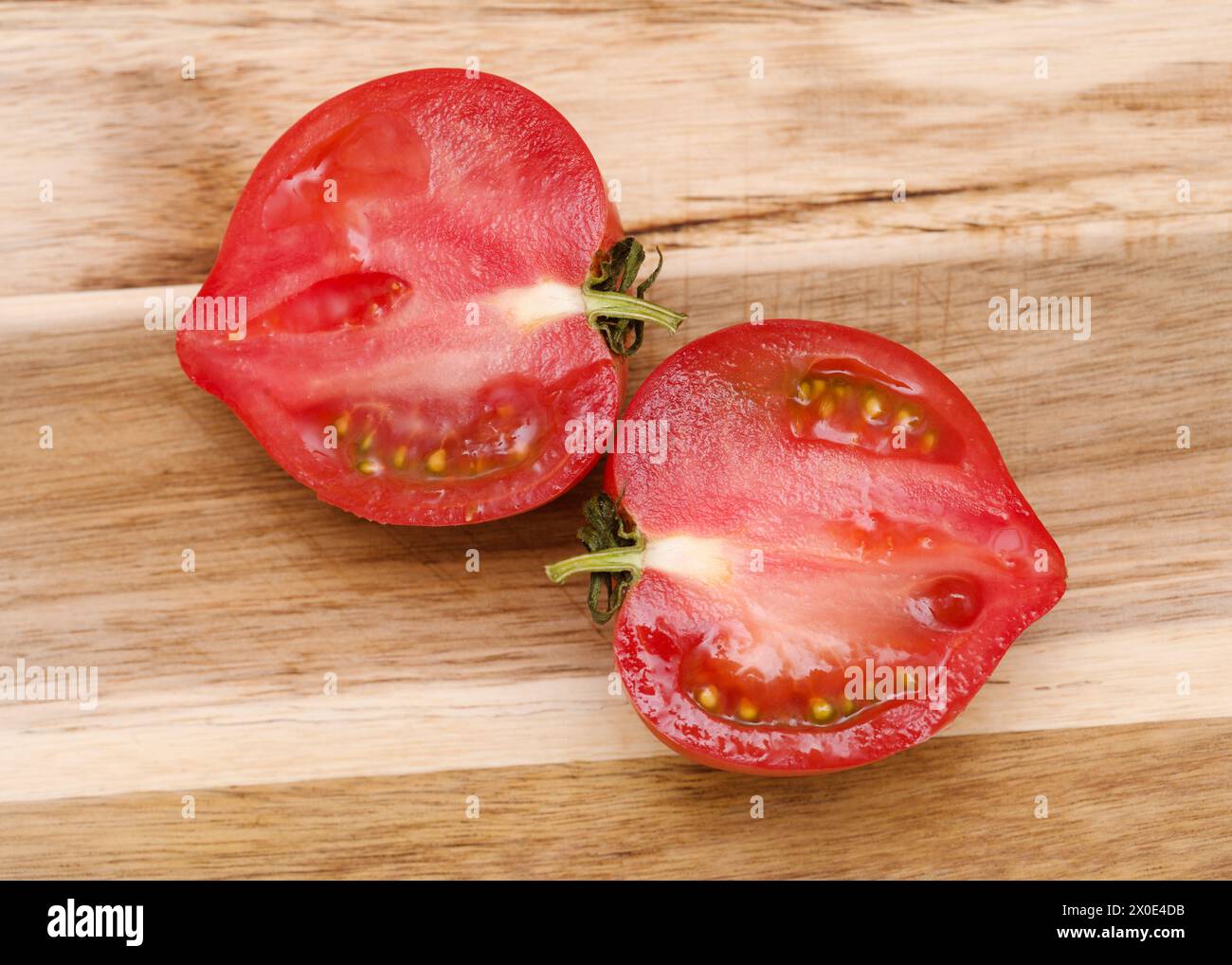 Round Pink tomato with a nose that produces heart shape when cut in ...