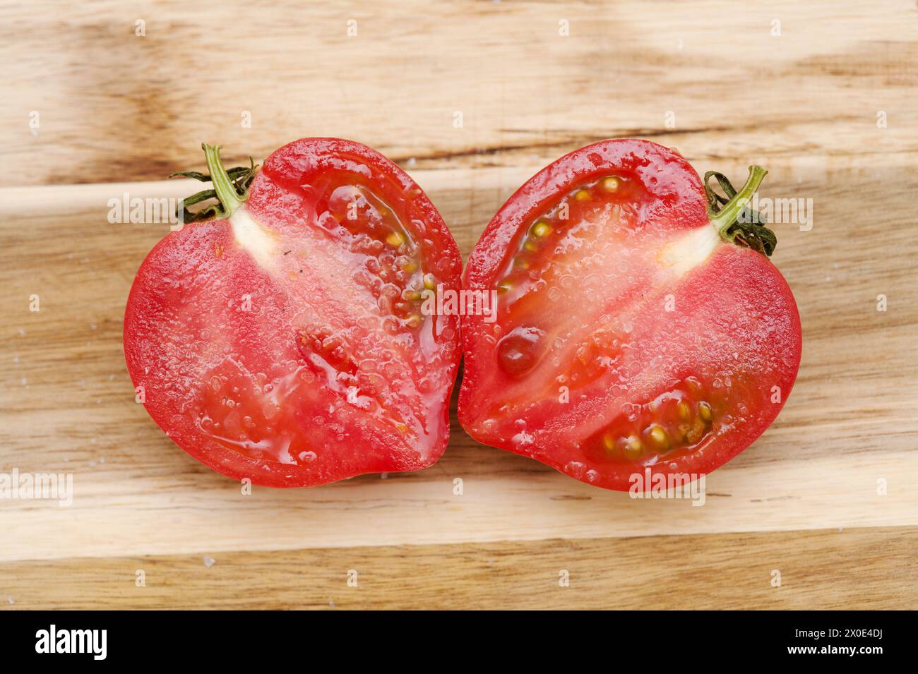 Round Pink tomato with a nose that produces heart shape when cut in ...