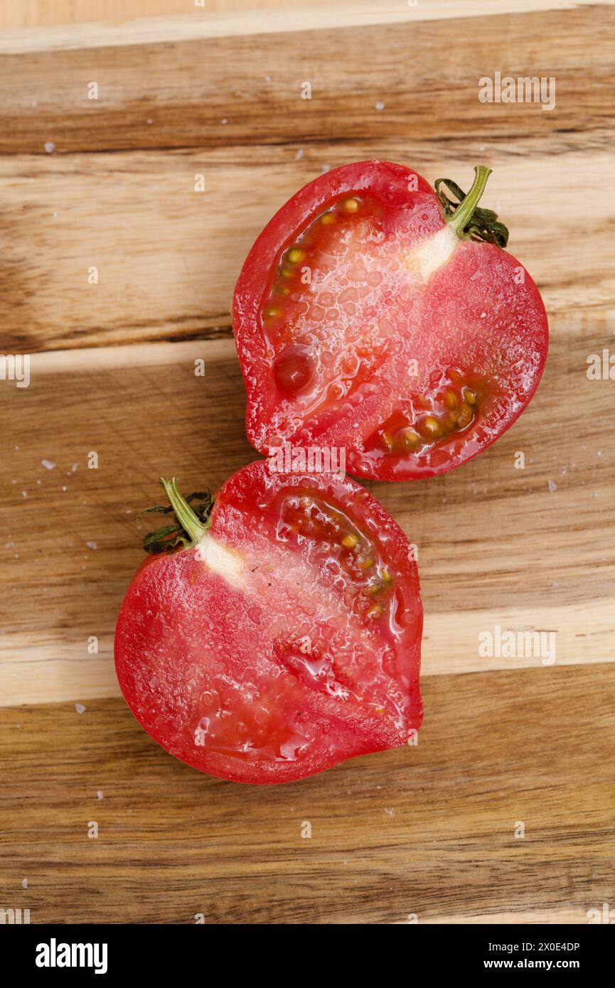 Round Pink tomato with a nose that produces heart shape when cut in ...