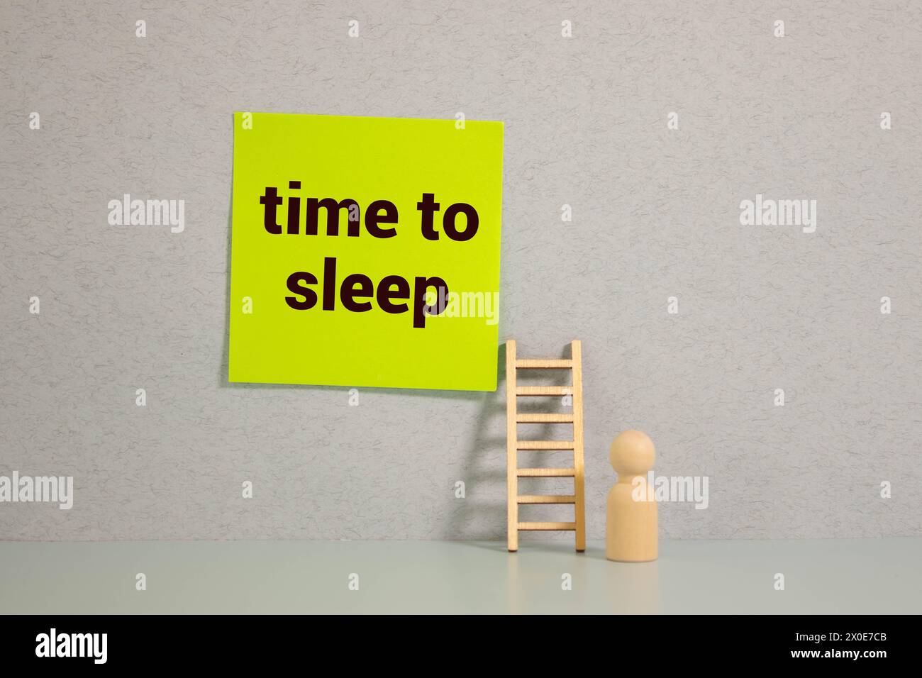 Alarm clock showing bed time at 9 PM with sign board on the bed Stock ...