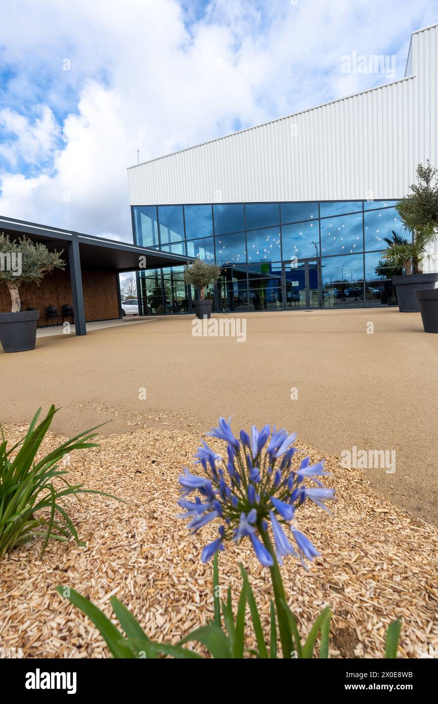 The construction of a modern sports complex with a huge glass roof and ...