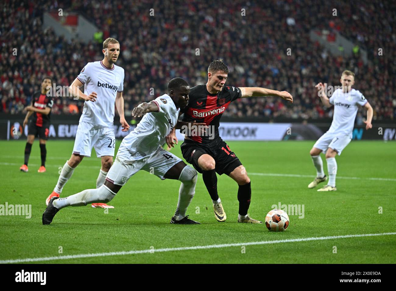 West Ham United's Kurt Zouma (left) and Bayer Leverkusen's Patrik ...
