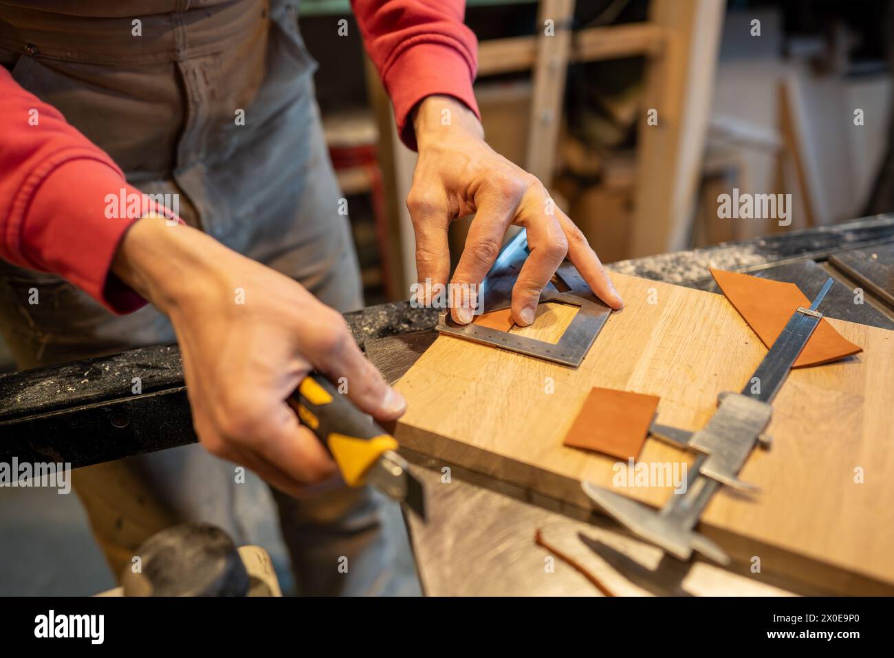 Male hands cutting leather skin. Master shoemaker cobbler professional ...