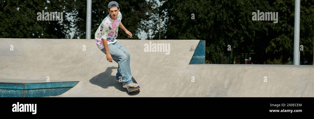A young skater boy fearlessly rides a skateboard up the steep side of a ...