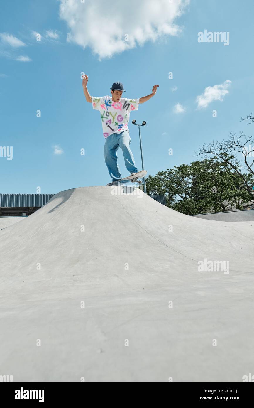A young skater boy joyfully rides his skateboard down the ramp of a ...