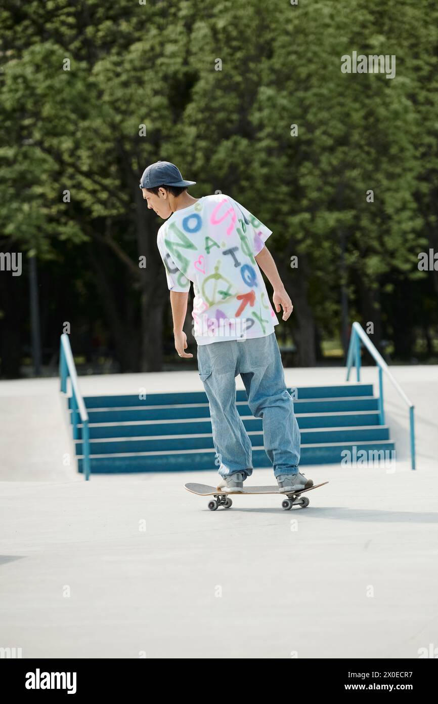 A young skater boy confidently rides his skateboard down the curved ...