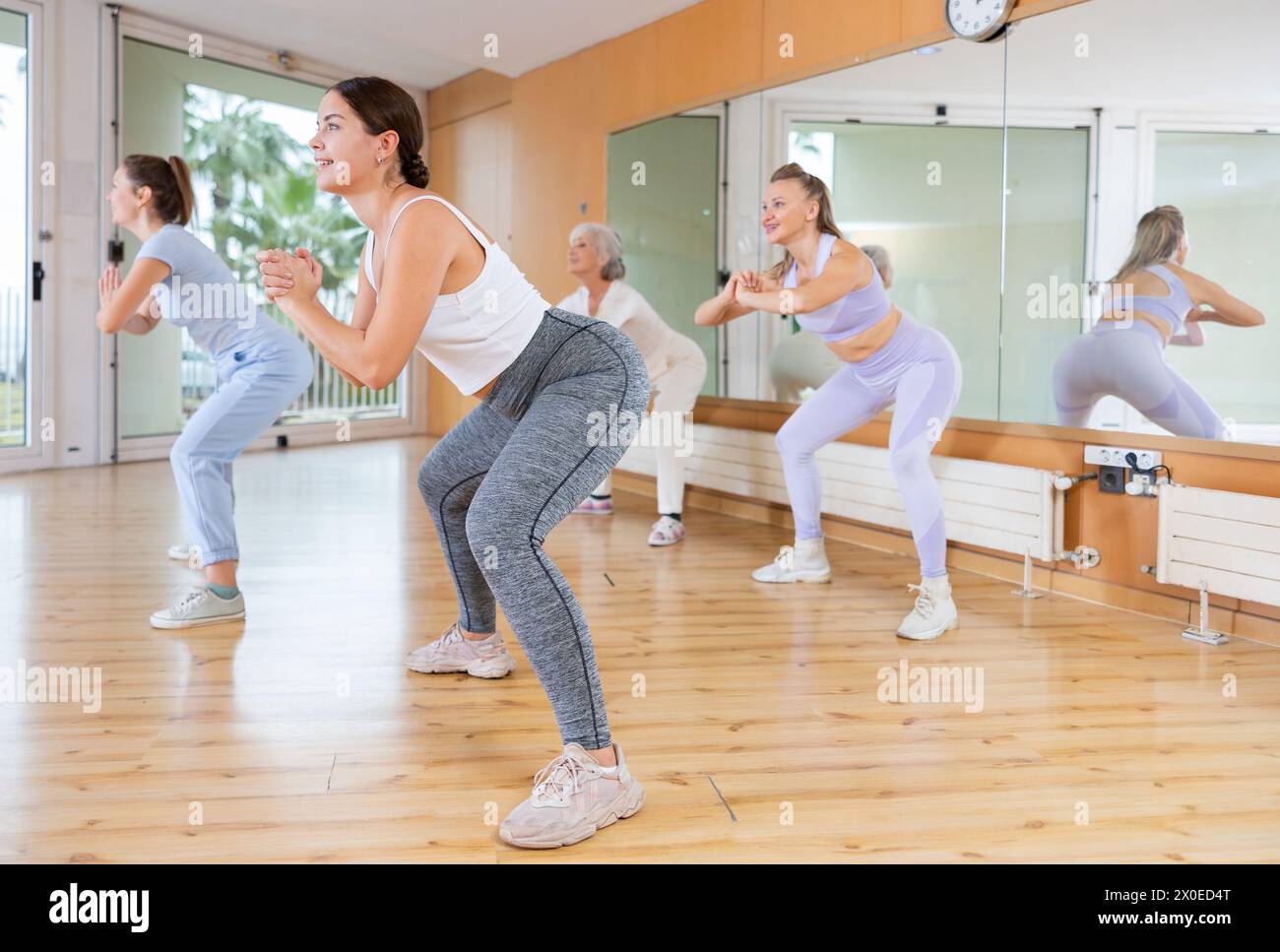 Active young woman practicing aerobic dance in training hall Stock ...