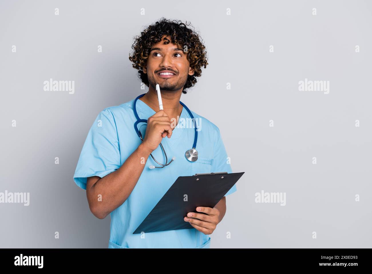Photo of doctor guy hold checklist thinking isolated grey color ...