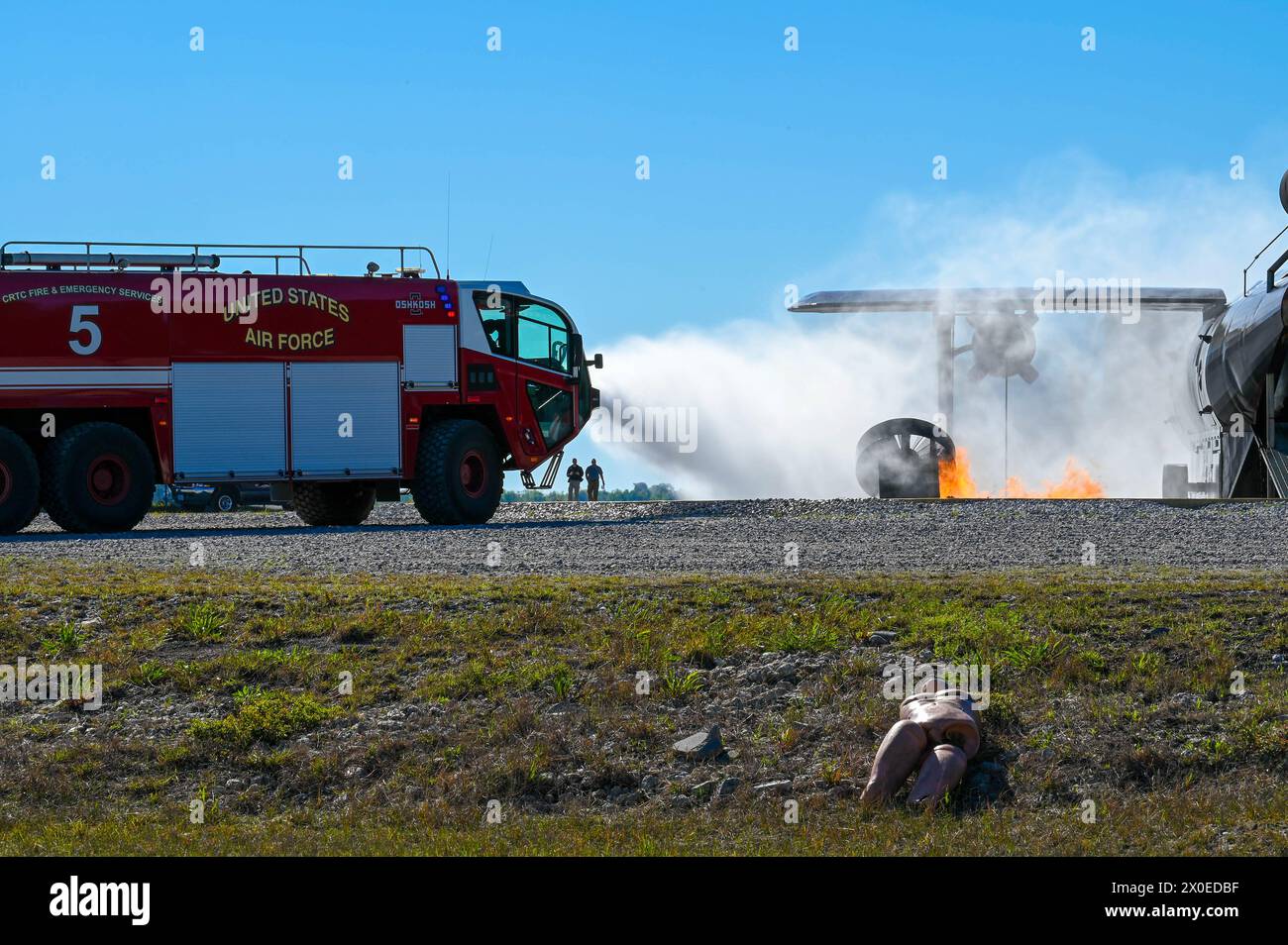 Members of the Combat Readiness Training Center Fire Department work to ...