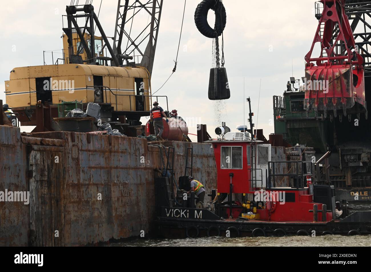 Salvage and wreckage removal crews continue operations on the collapsed ...
