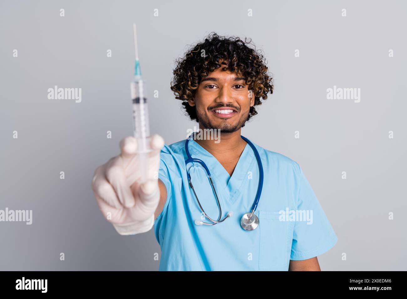 Photo of doctor guy show syringe vaccine isolated grey color background ...