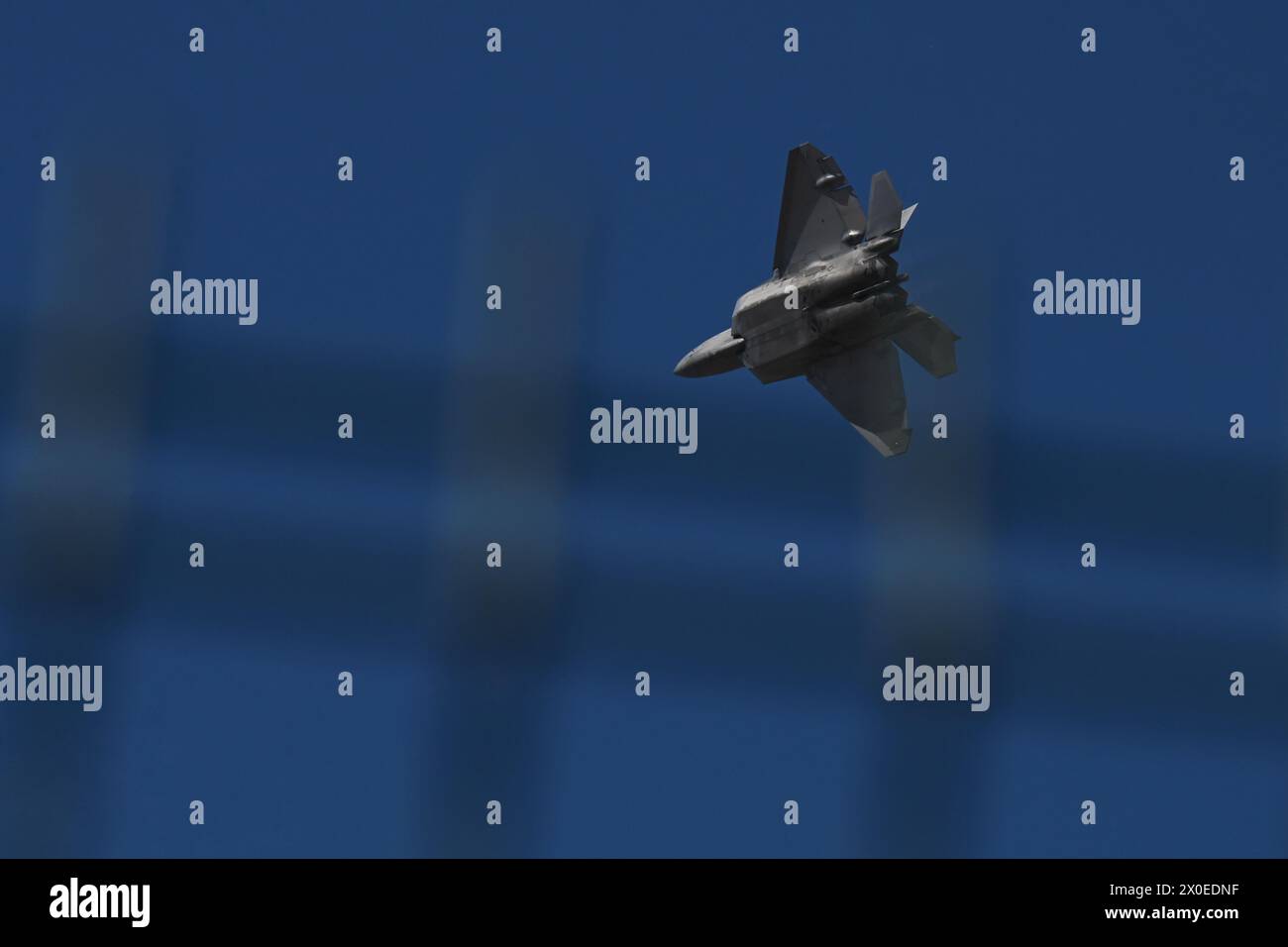 A U.S. Air Force F-22 Raptor Demonstration Team aircraft zips through ...