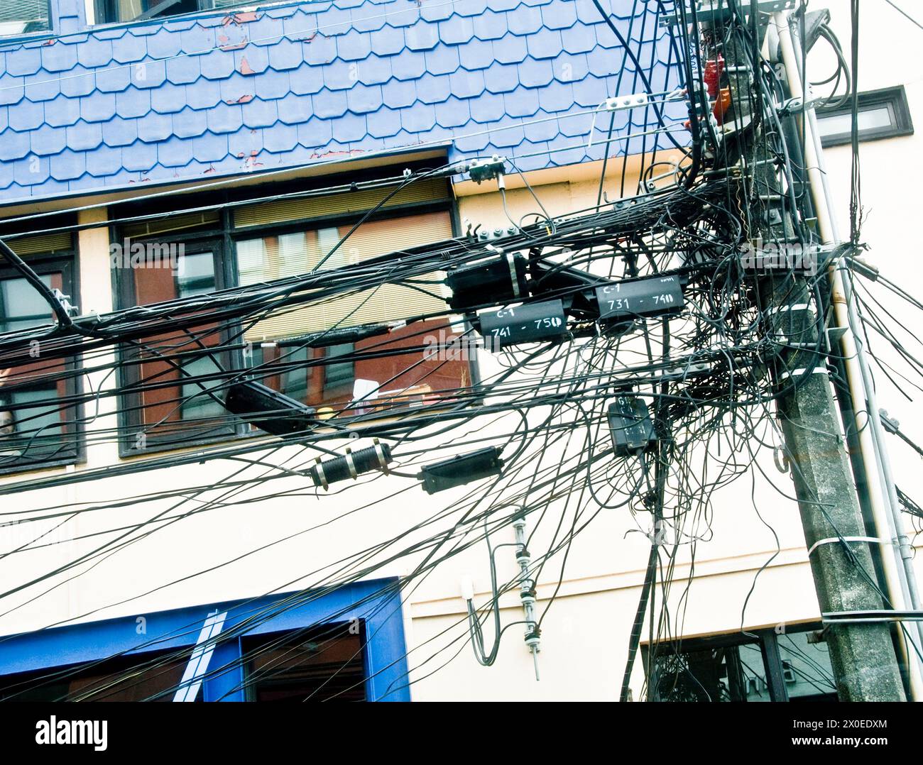 utility pole and mess of wiring - Puerto Montt, Chile Stock Photo - Alamy