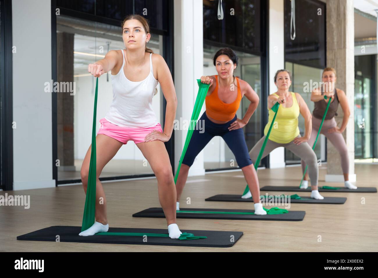 Women doing stretches with resistance bands Stock Photo - Alamy