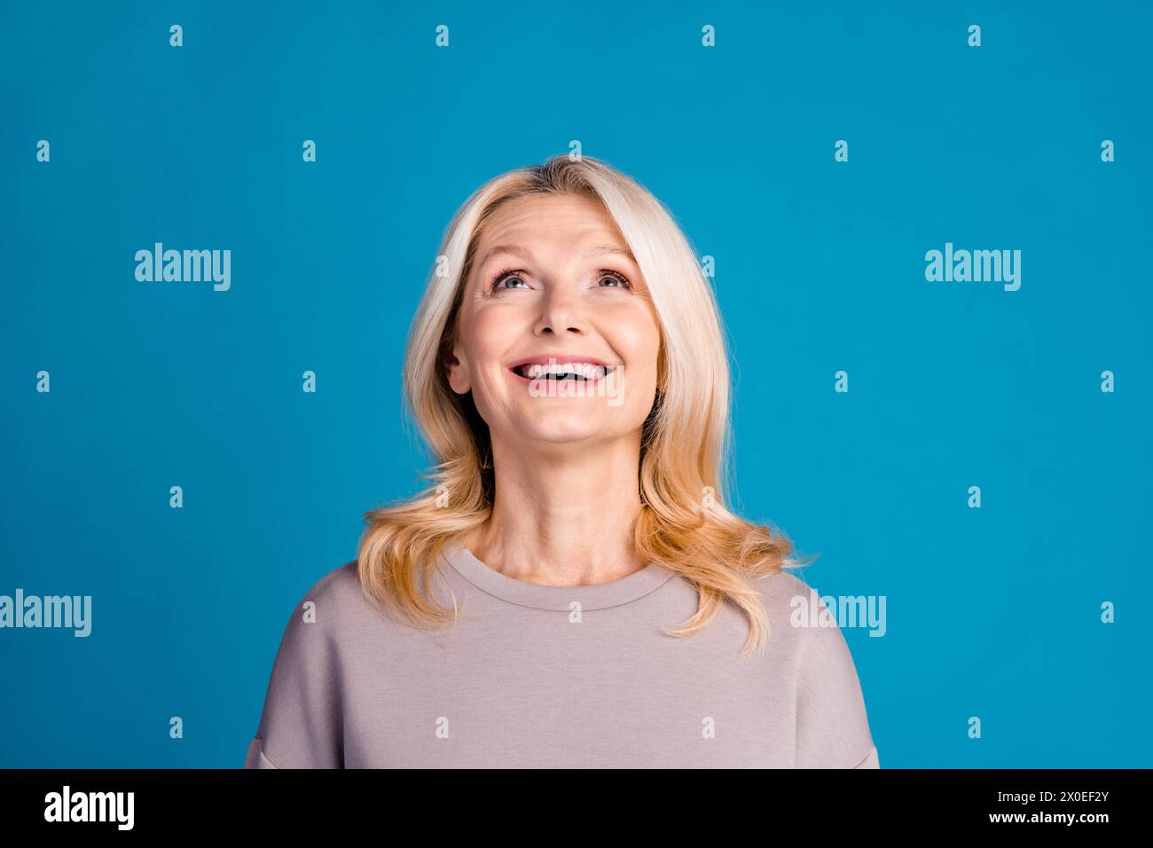 Photo portrait of lovely senior lady look up empty space dressed ...