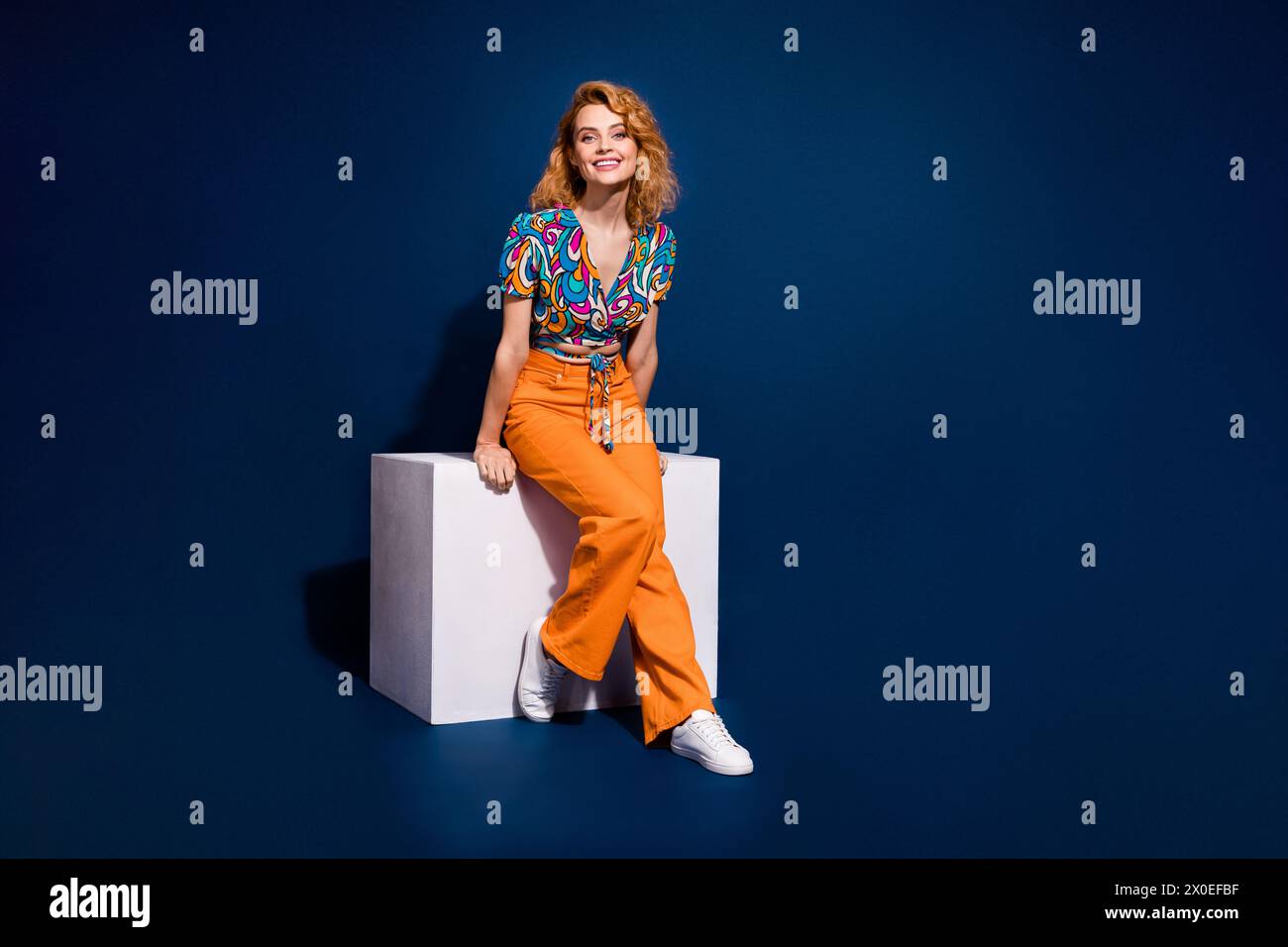 Full body portrait of nice young lady sit cube empty space wear top ...