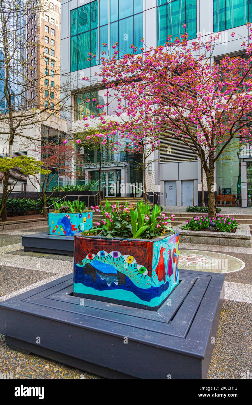 Colourful courtyard between glass towers in downtown Vancouver Canada ...