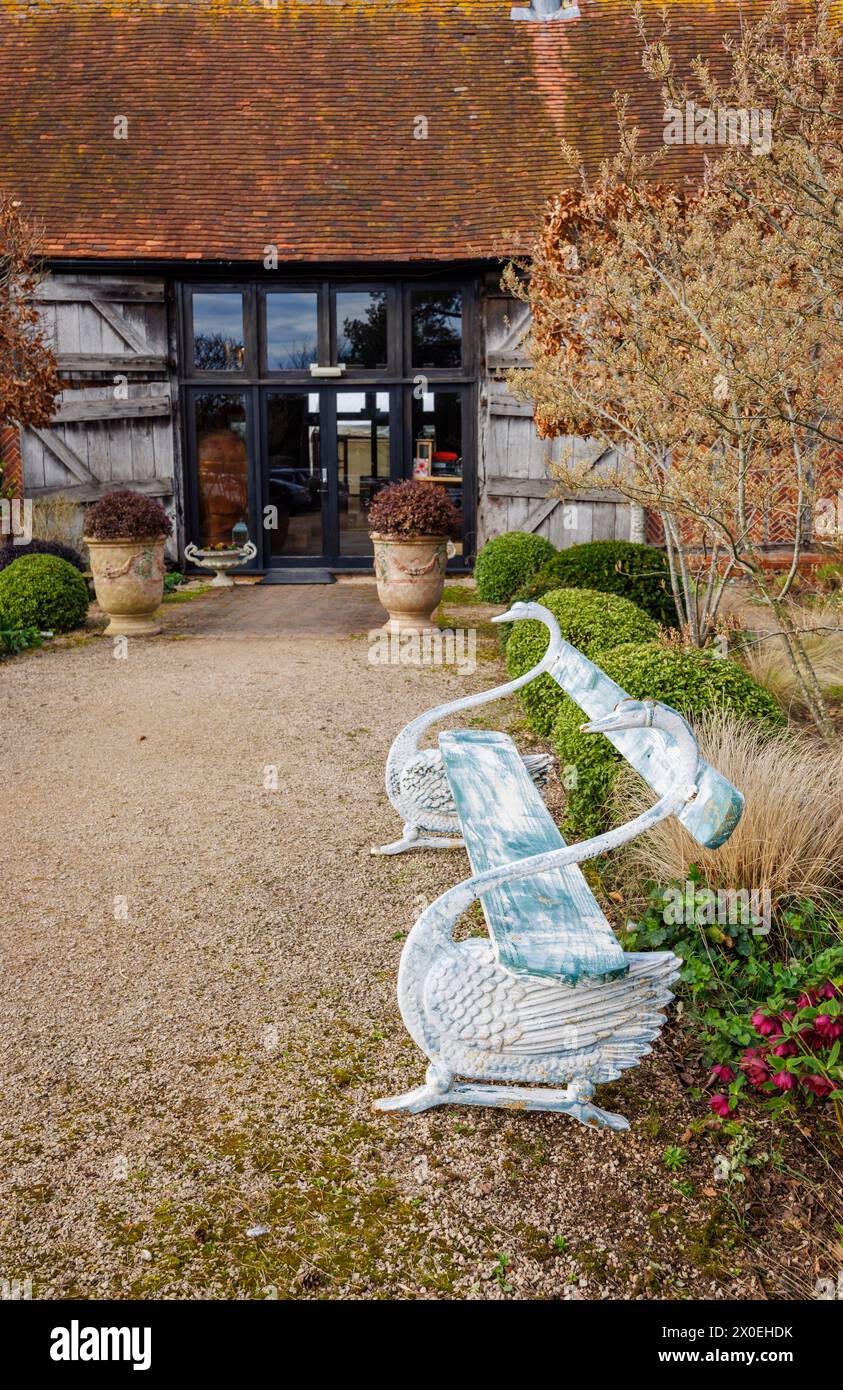 Elegant antique swan neck bench in the garden at Bix Manor, Bix, near ...
