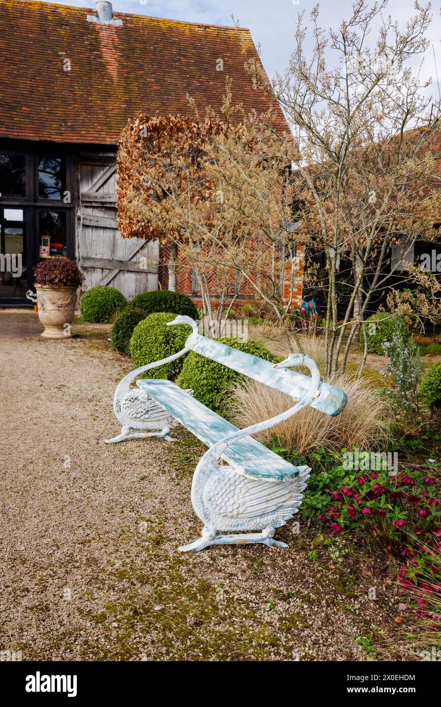 Elegant antique swan neck bench in the garden at Bix Manor, Bix, near ...