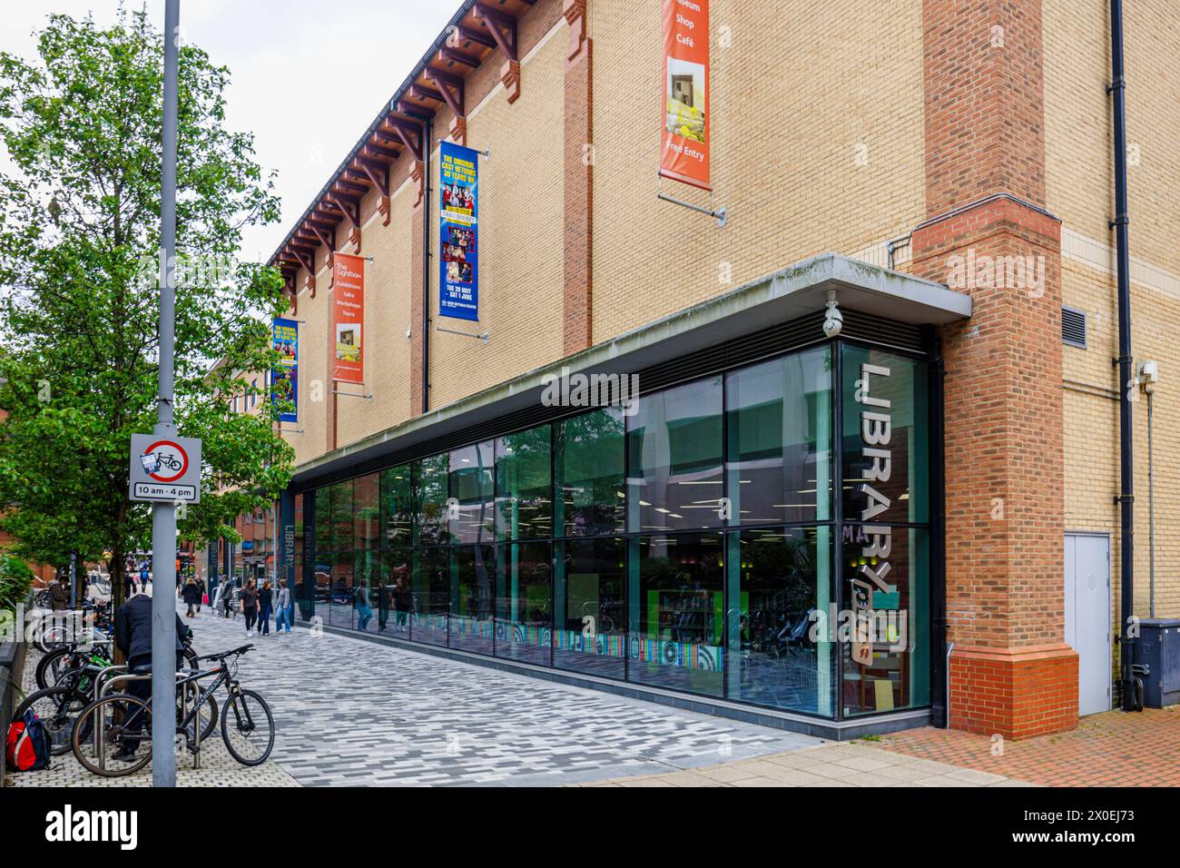 The modern glass-fronted public library in the town centre of Woking, a ...