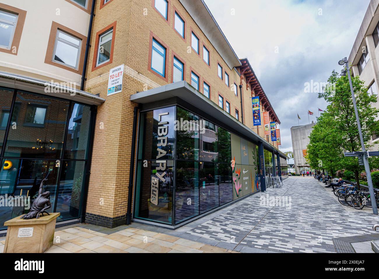 The modern glass-fronted public library in the town centre of Woking, a ...