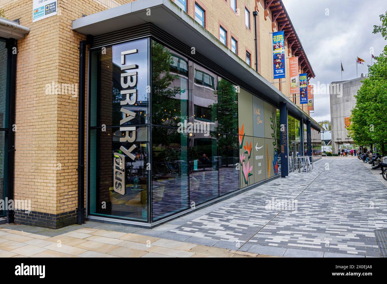 The modern glass-fronted public library in the town centre of Woking, a ...