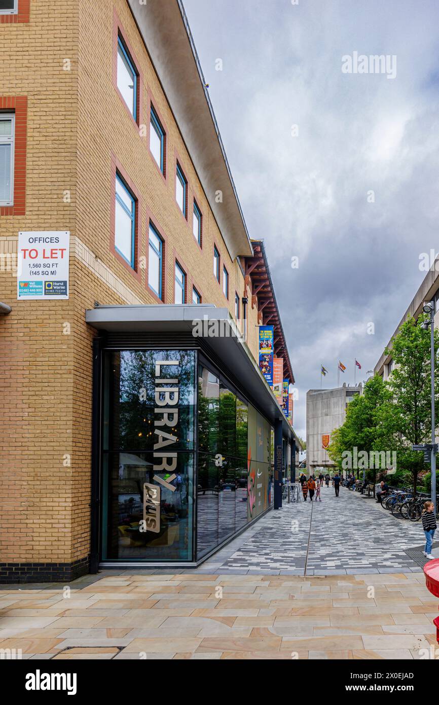The modern glass-fronted public library in the town centre of Woking, a ...
